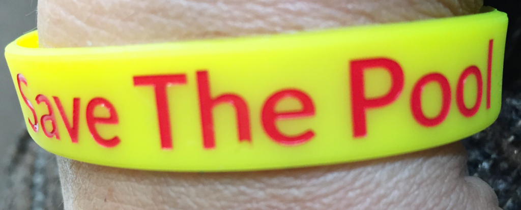 Save The Pool Wristband Being Used To... Save The Pool, Duh!